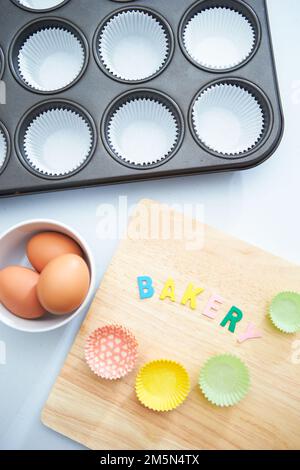 Wooden fork and spoon and Bakery word Stock Photo - Alamy