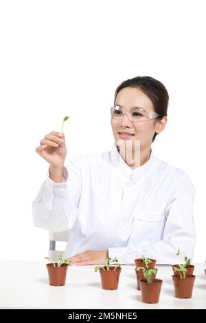 Young women scientists study looked at plants Stock Photo - Alamy