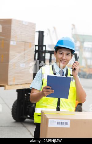 Logistics warehouse management personnel with interphone Stock Photo ...