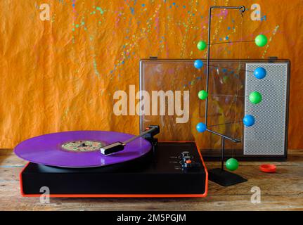Retro turntable with purple vinyl record, close up, selective focus ...