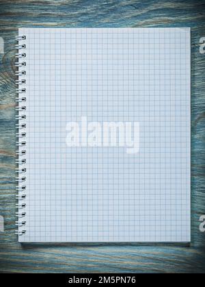 checked note paper on wooden background Stock Photo - Alamy