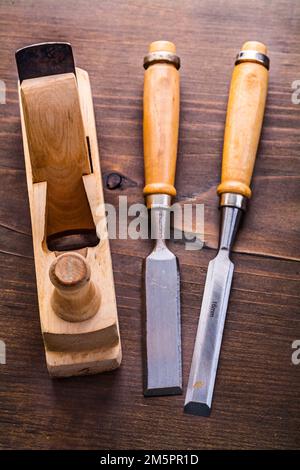chisels and woodworkers plane on wooden board construction concept ...