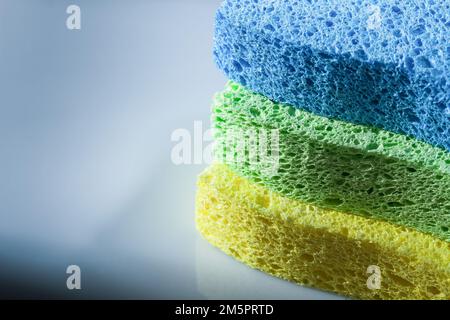 New kitchen sponges on white background Stock Photo - Alamy