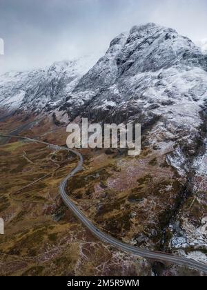 Aerial view of mountains in Glen Coe in winter snow, Scottish Highlands ...