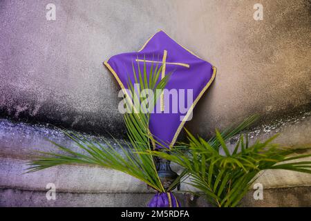 Holy Week. Cross covered with purple fabric in the period of lent ...
