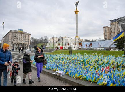 People are seen walking along the Independence Square in central of ...