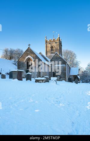 St Oswald's church in the early morning winter snow. Compton Abdale ...