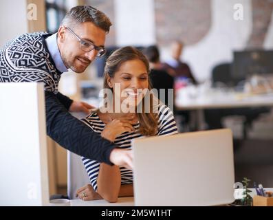 Making great progress on their project. two colleagues working together ...