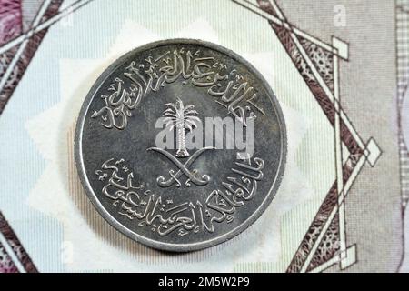 Crossed swords and palm tree at center of obverse side of old Saudi ...