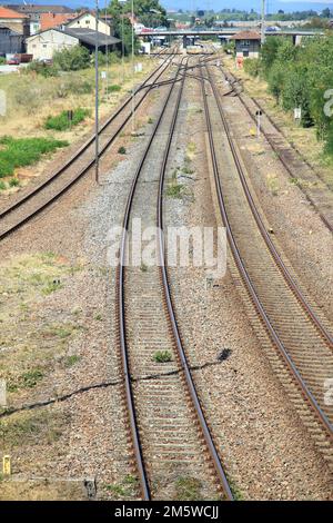 Railroad tracks lead through a natural landscape Stock Photo - Alamy