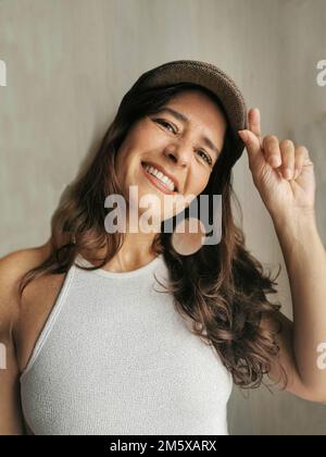 Beautiful middle age casual adult woman over isolated background very ...