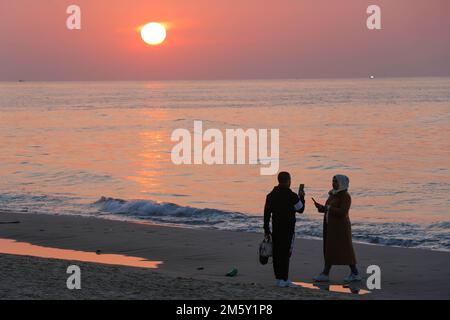 Gaza, Palestine. 31st Dec, 2022. Palestinians light a torch during the ...