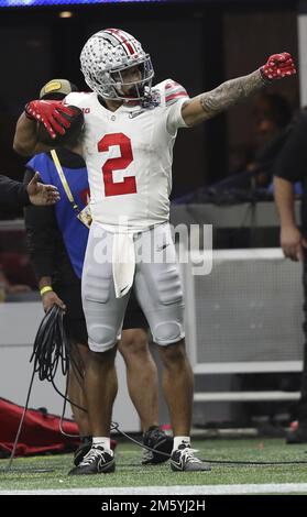 Ohio State wide receiver Emeka Egbuka (2) is tackled by Michigan State ...