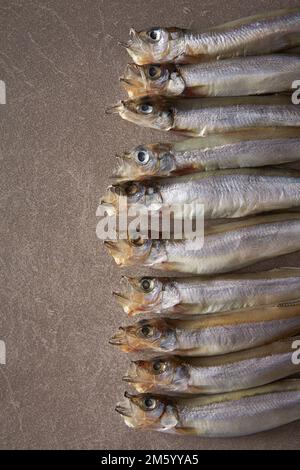 Fish pattern. Small sea fish, smelt on the blue background Stock Photo ...