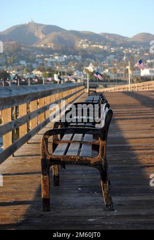 Side view of benches at sunset in Ventura Pier, California Stock Photo ...