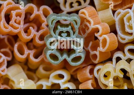 Closeup of Teddy Bear shapes colorful pasta background for design ...