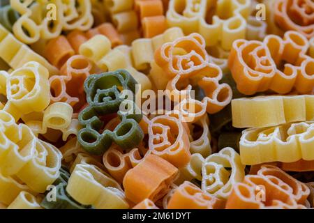 Closeup of Teddy Bear shapes colorful pasta background for design ...