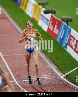 Maureen Koster reaching the finish line in the 5000 meters at the ...