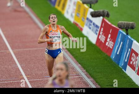 Maureen Koster reaching the finish line in the 5000 meters at the ...