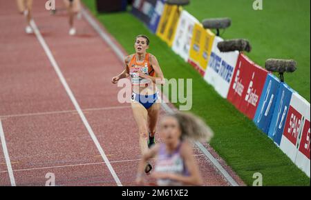 Maureen Koster reaching the finish line in the 5000 meters at the ...