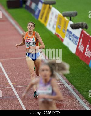 Maureen Koster reaching the finish line in the 5000 meters at the ...