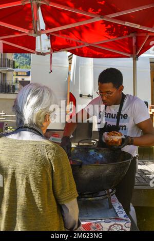 View of the weekly street market of Chamonix crowded with locals and ...