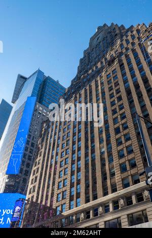Brightly colored confetti pieces swirl over Times Square on New Year's ...