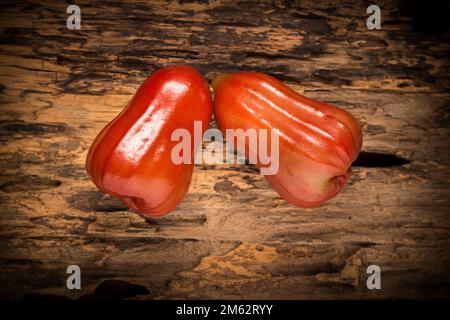 rose apple on wood. dark. night Stock Photo - Alamy