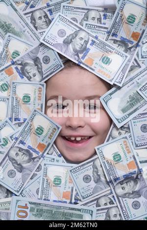 Funny face in lot of money. Fun kid face on dollars money. Money ...