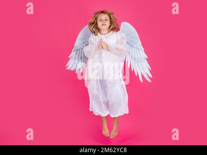 Little angel jump, kids jumping, full body. Little angel fly. Child at ...