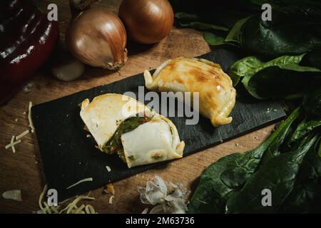 From above of appetizing argentinian empanadas served on flat plate on ...