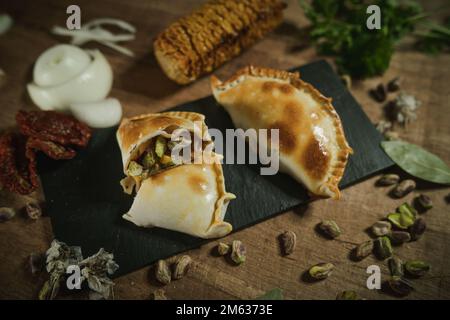 From above of appetizing argentinian empanadas served on flat plate on ...