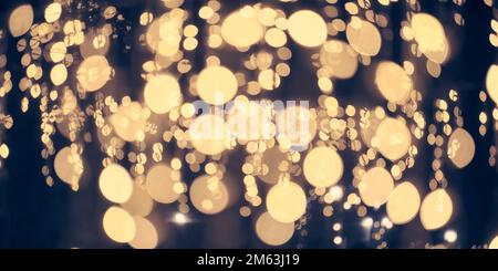 Pale yellow lights bokeh from christmas holiday garlands, blurred ...