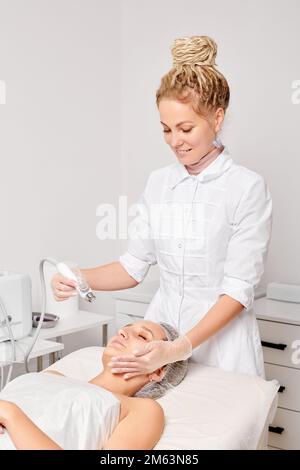 Beautician makes facial gas liquid oxygen serum epidermal peeling for ...