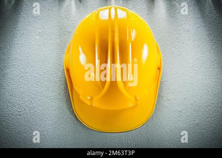 Yellow safety cap on concrete background construction concept Stock ...