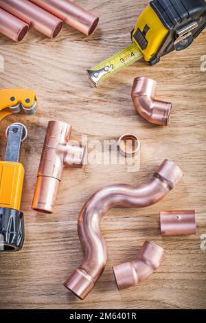 Plumbing Tools Composition Of Brass Pipe Connectors On Wooden Board and ...