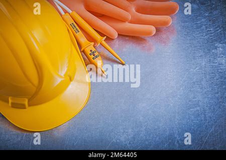 Insulating gloves building helmet electric tester on metallic ...
