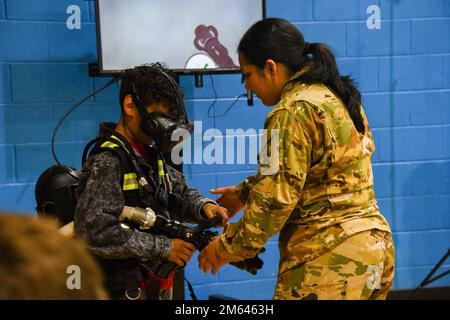 An Altus Junior High School student hugs a Meccano robot at Altus High ...