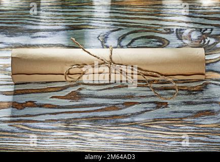 Vintage paper roll on wooden board Stock Photo - Alamy