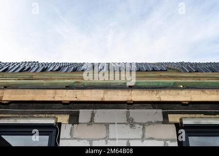 Roof ceramic tile arranged in packets on the roof on roof battens ...