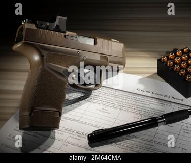 Semi auto pistol with cartridges and public domain form 4473 for a ...