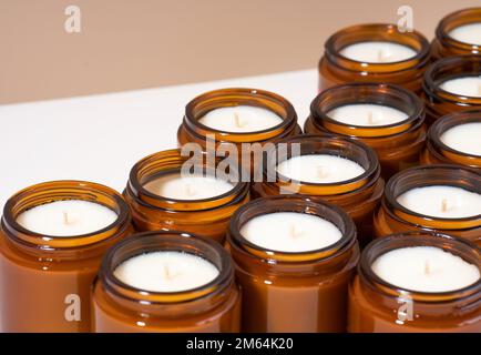 Scented candles and jars with essential oil. Dried lavender ...