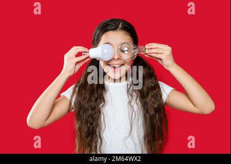 photo of glad teen girl with lightbulb. teen girl with lightbulb ...