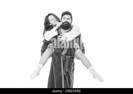 Playful woman twirl moustache riding piggyback on man isolated on white ...