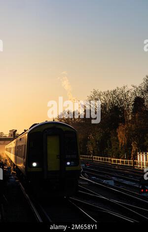 A South Western train approaches Woking station during a period of ...