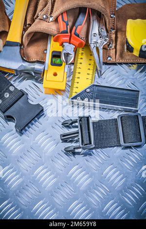 Leather building belt on grooved metal sheet construction concept Stock ...