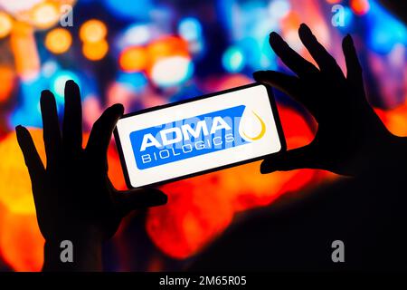 In this photo illustration, the ADMA Biologics logo is displayed on a ...
