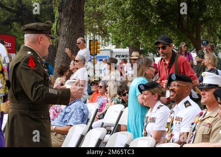 Lt. Gen. John Evans, commanding general of Army North, speaks to one of the horse donors in ...