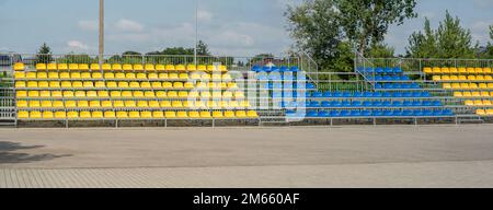 Simple empty vacant small stadium seats outdoors, bleachers, nobody, no ...