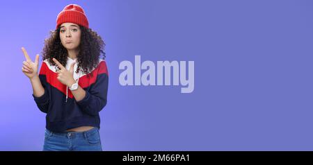 Portrait of silly upset cute curly-haired woman in trendy beanie ...